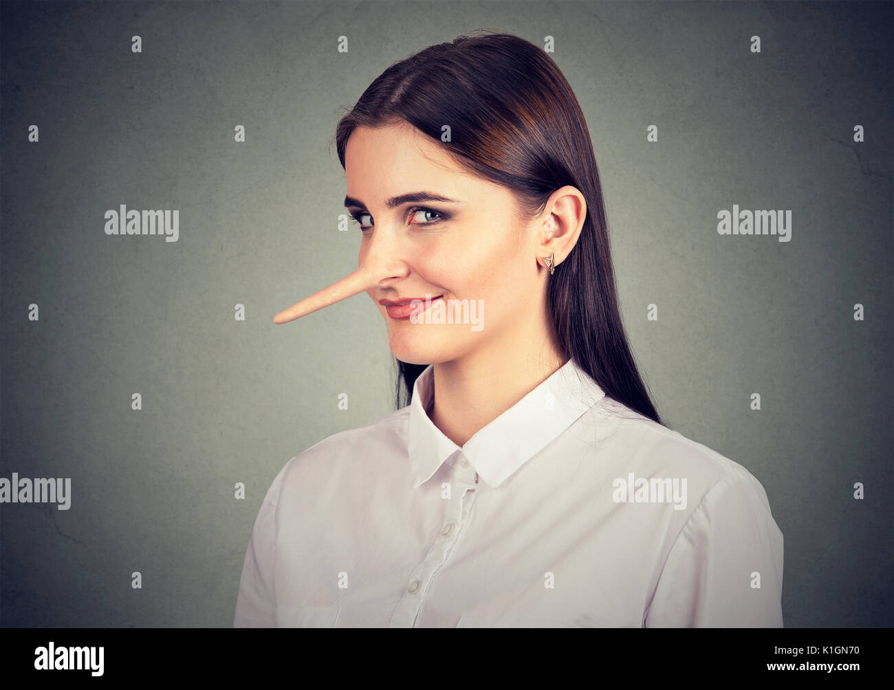 Liar sly funny looking young woman Stock Photo - Alamy