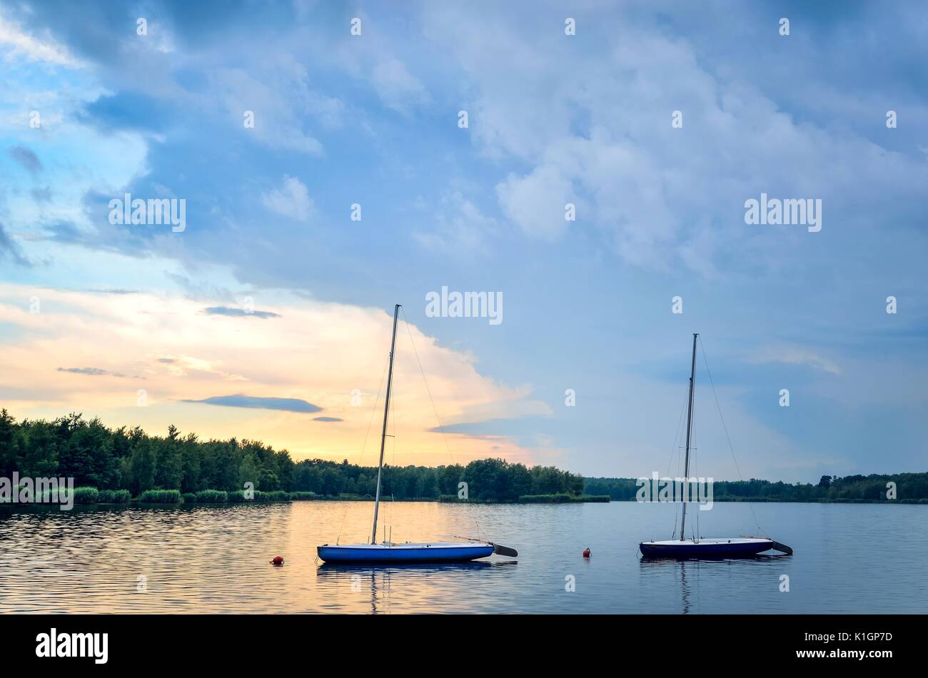 Boats on a beautiful lake. Evening summer landscape by the water Stock ...