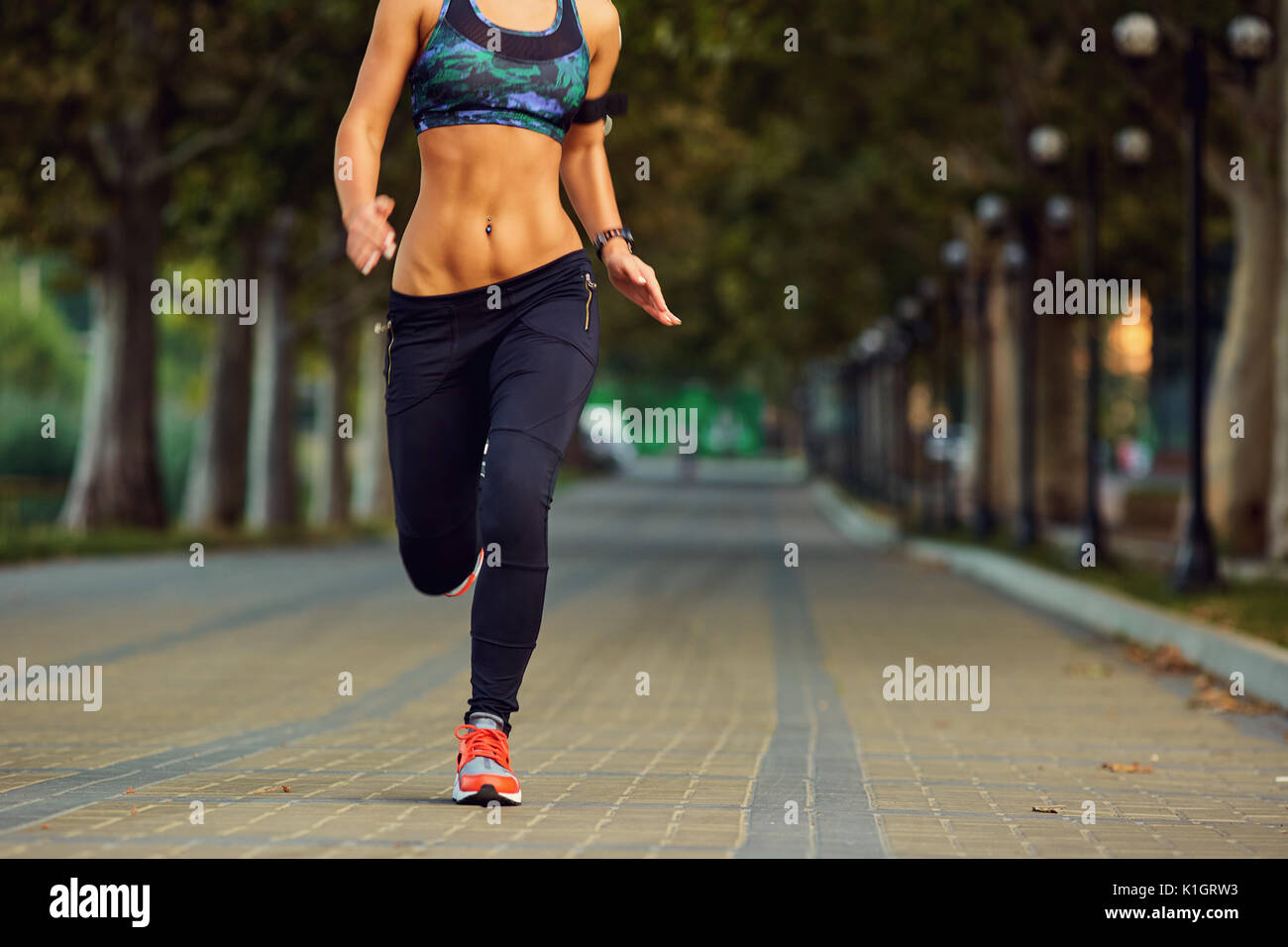Female runner park hi-res stock photography and images - Alamy