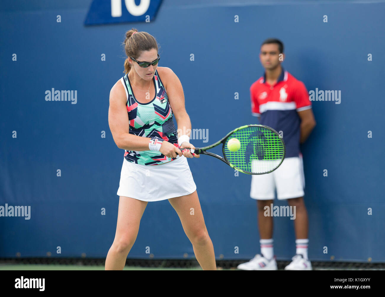Jamie Loeb of USA returns ball during qualifying game against Sachia ...