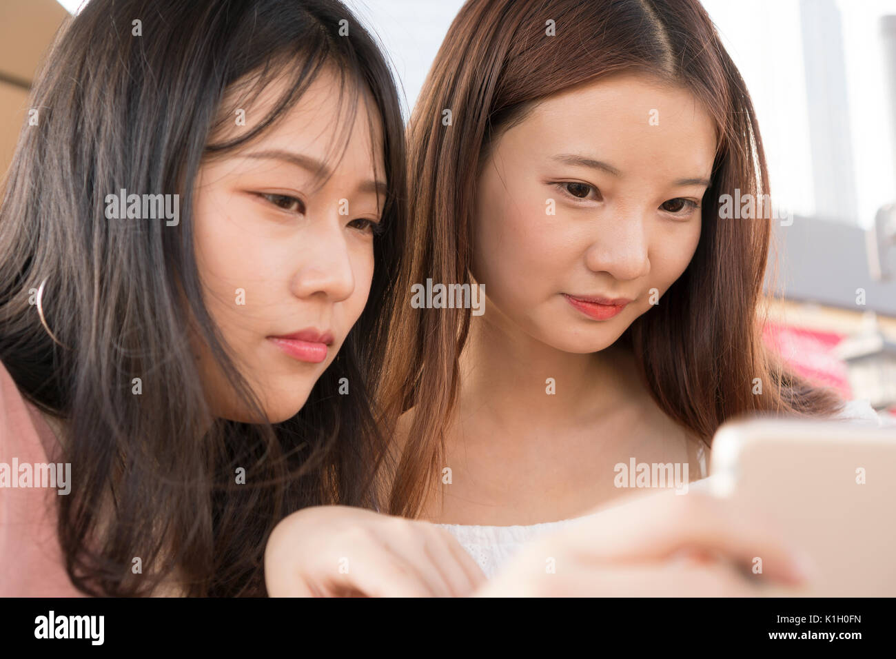 girls watching tablet Stock Photo - Alamy