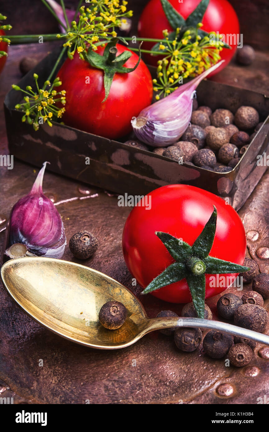 preserving autumn tomatoes with spices for the winter Stock Photo - Alamy