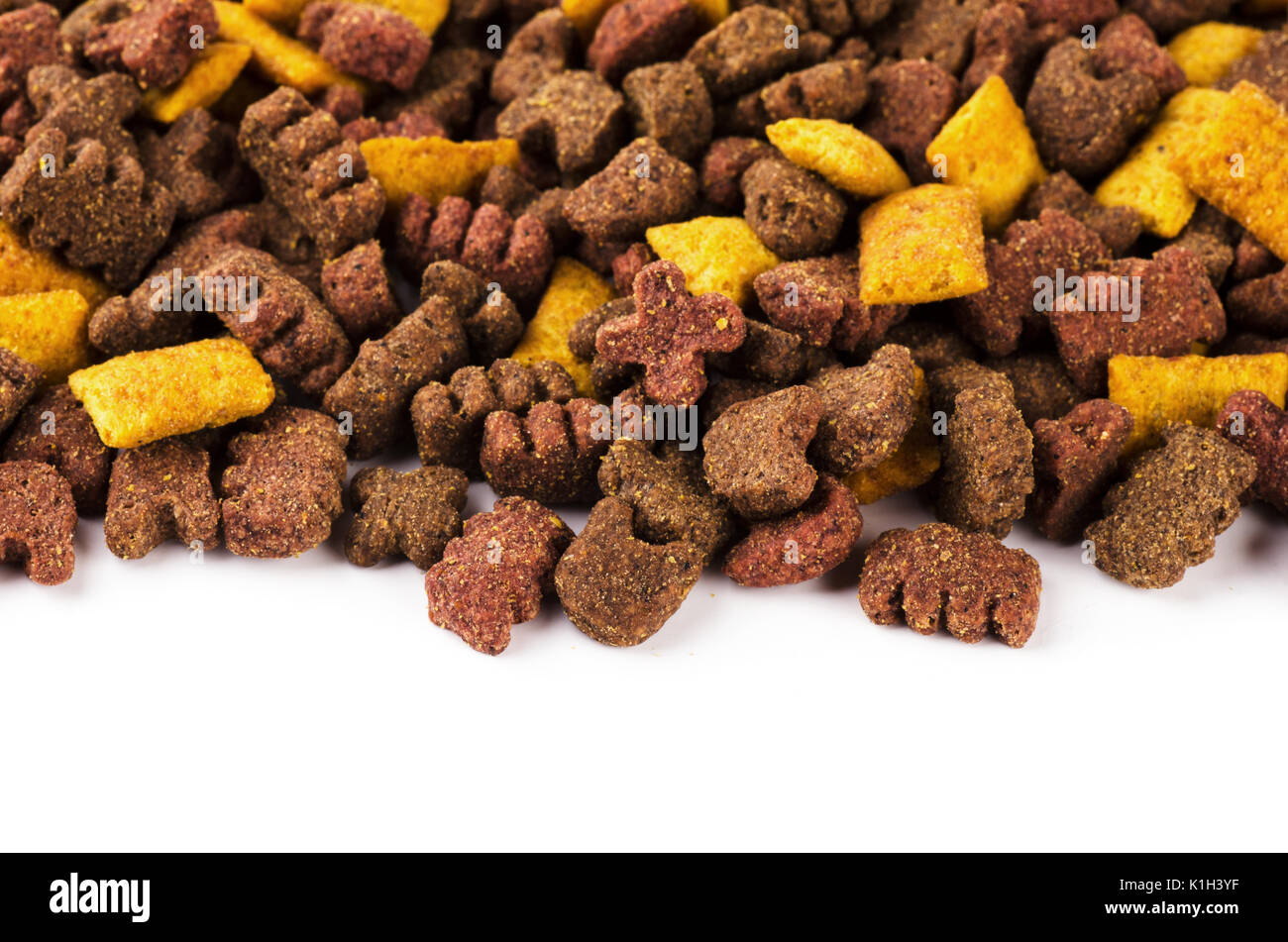 Dry pet food isolated on a white background Stock Photo - Alamy