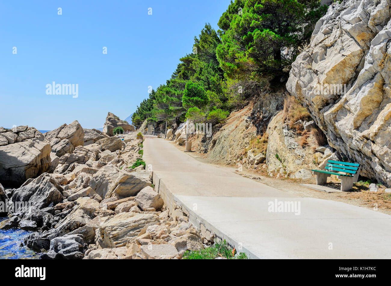 Concrete path by the sea. Photographed in the summer Stock Photo - Alamy