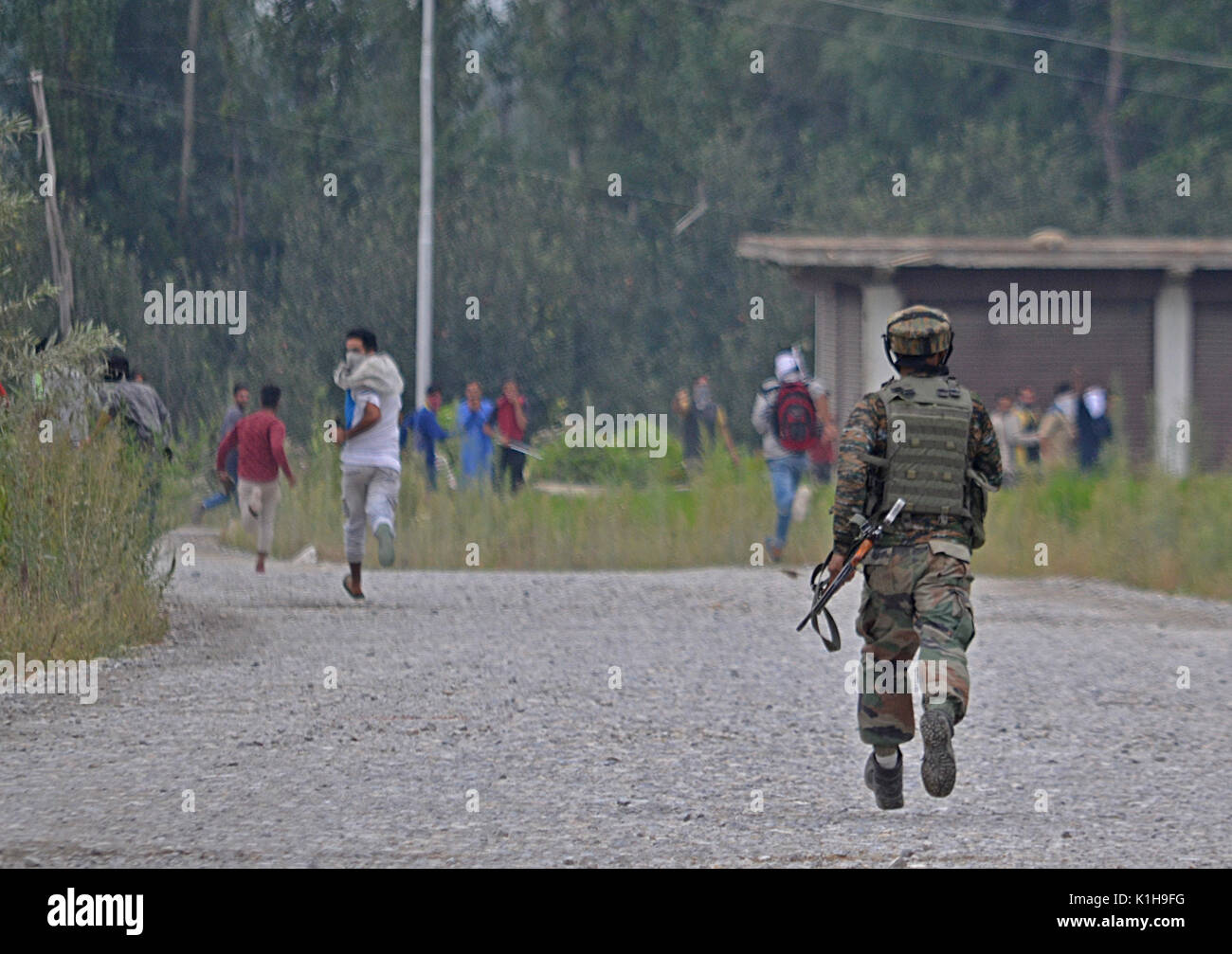 Man chasing indian hi-res stock photography and images - Alamy