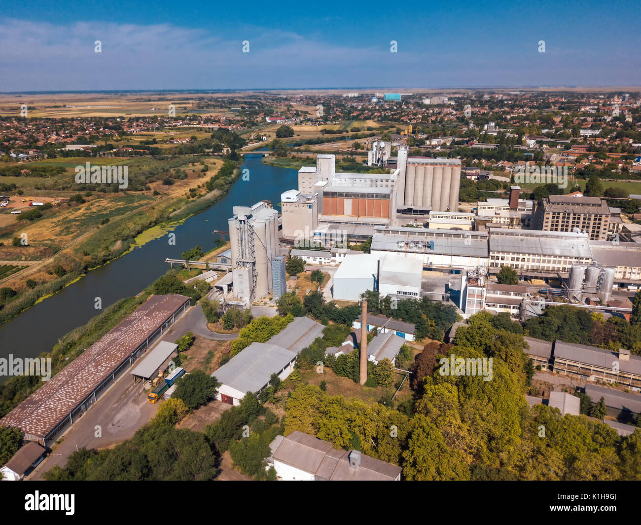 Drone pov aerial view of industrial cityscape with factory buildings ...