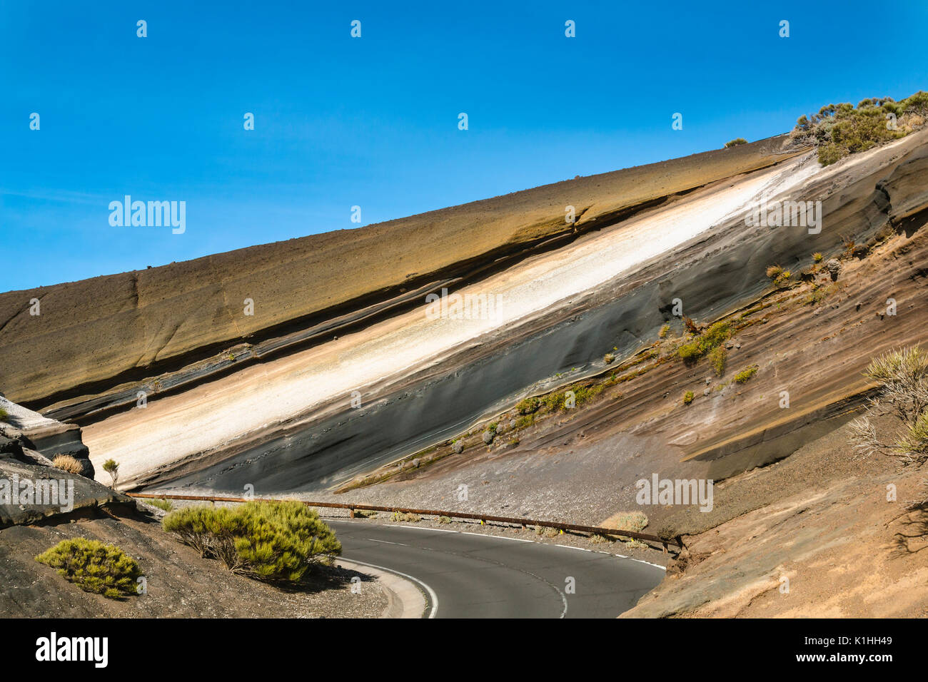 Colorful volcanic rock layers in a bend of the TF24 road in Tenerife, Spain Stock Photo - Alamy