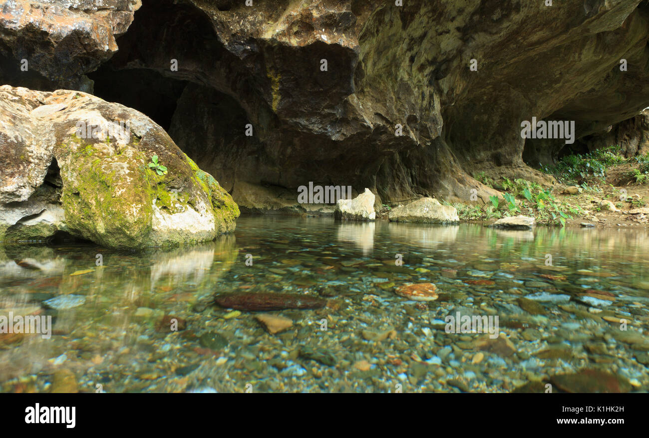 River coming out of cave Stock Photo - Alamy