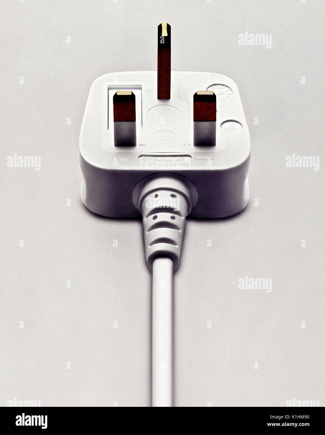 A plug against a plain background Stock Photo - Alamy