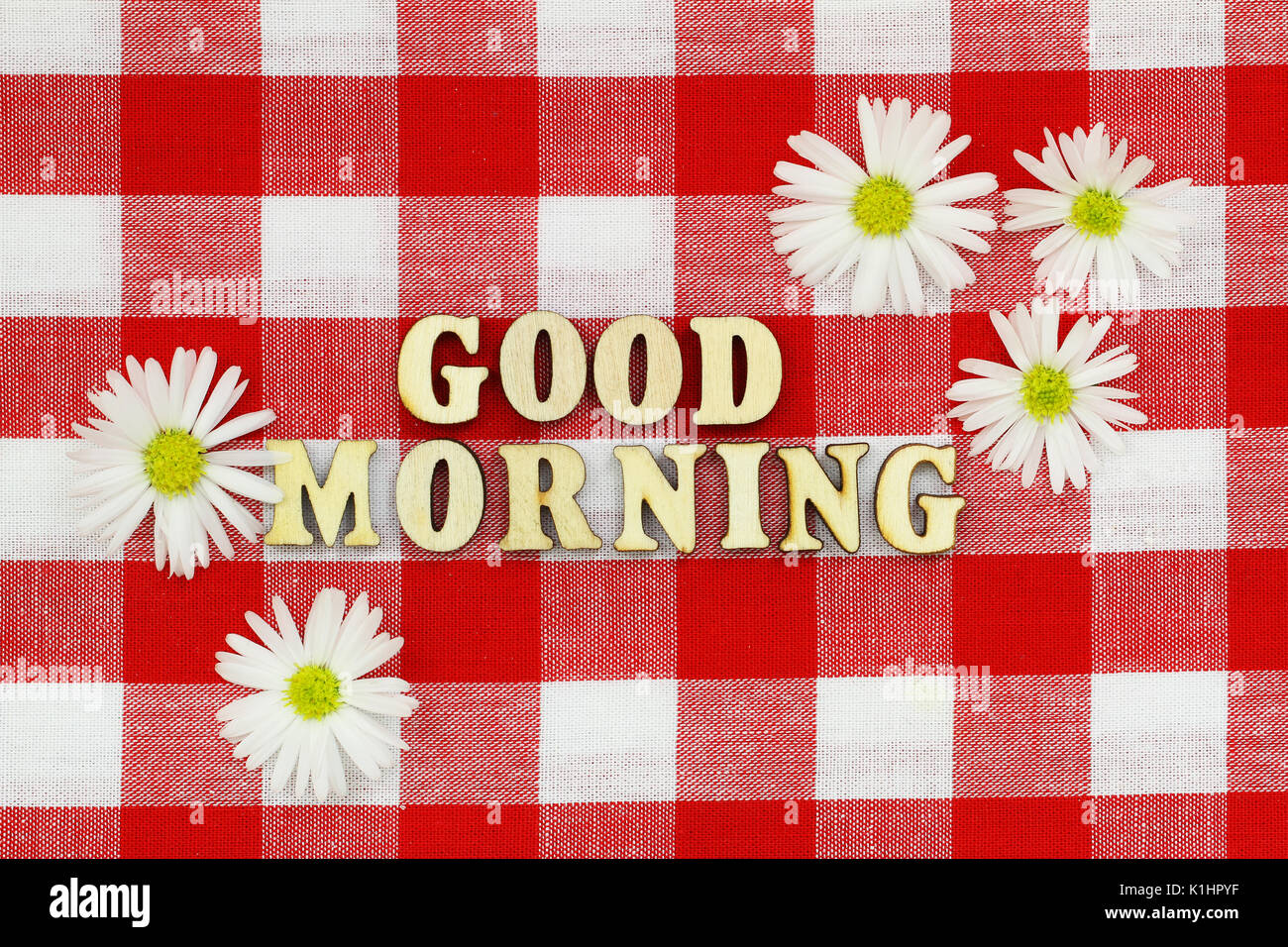 Good morning written with wooden letters on red and white checkered ...