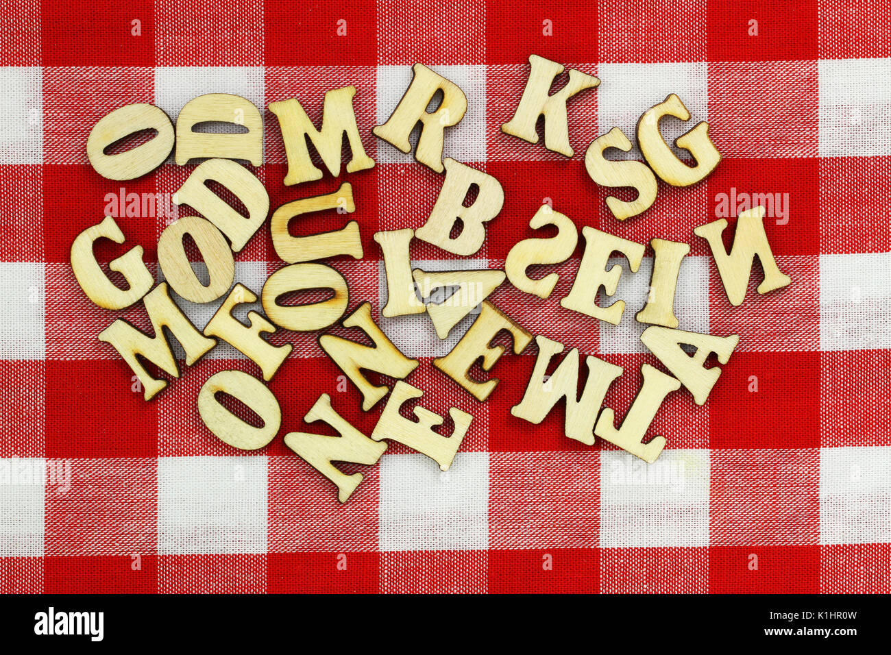 Wooden letters scattered on red and white checkered cloth Stock Photo ...