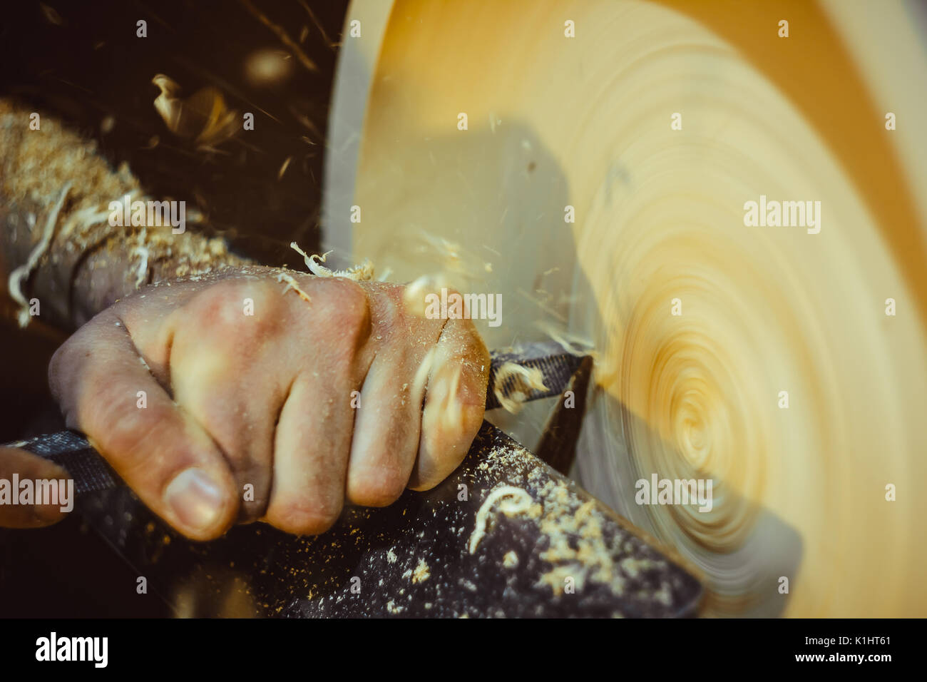 man turning a wooden plate on a lathe Stock Photo - Alamy