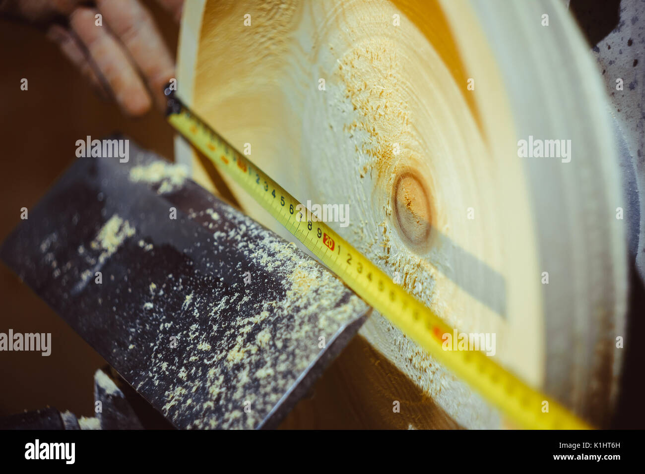 man turning a wooden plate on a lathe Stock Photo - Alamy