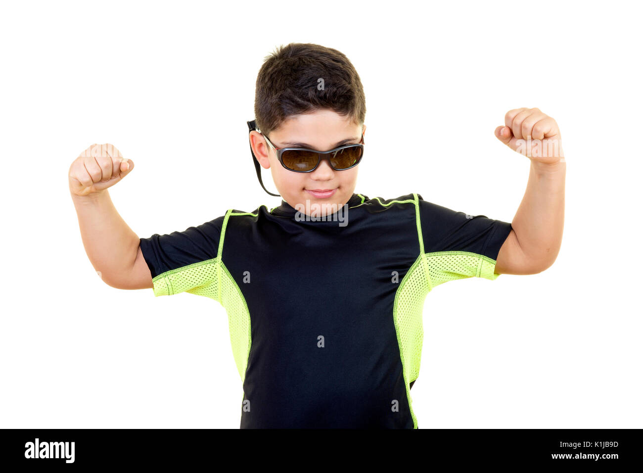 Little boy is showing his strength with a confident pose in front of a ...