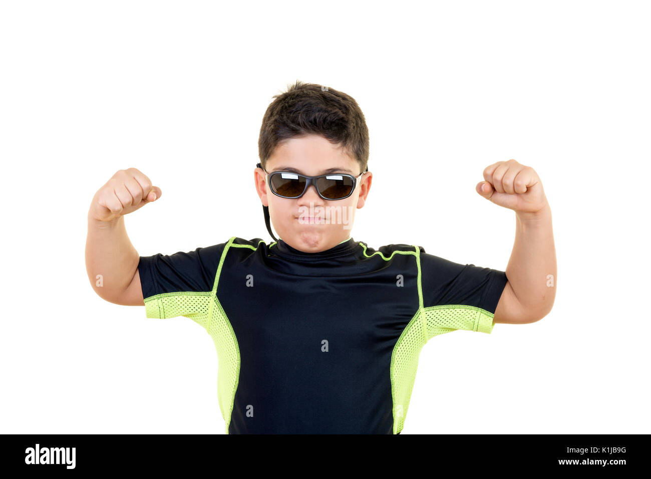 Little boy is showing his strength with a confident pose in front of a ...
