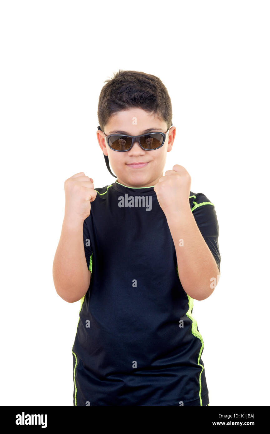 Little boy is showing his strength with a confident pose in front of a ...