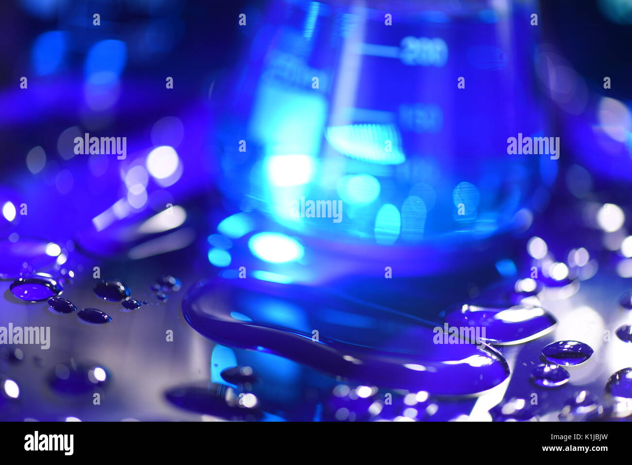 Graduated Conical Science Beakers on blue acrylic Stock Photo - Alamy