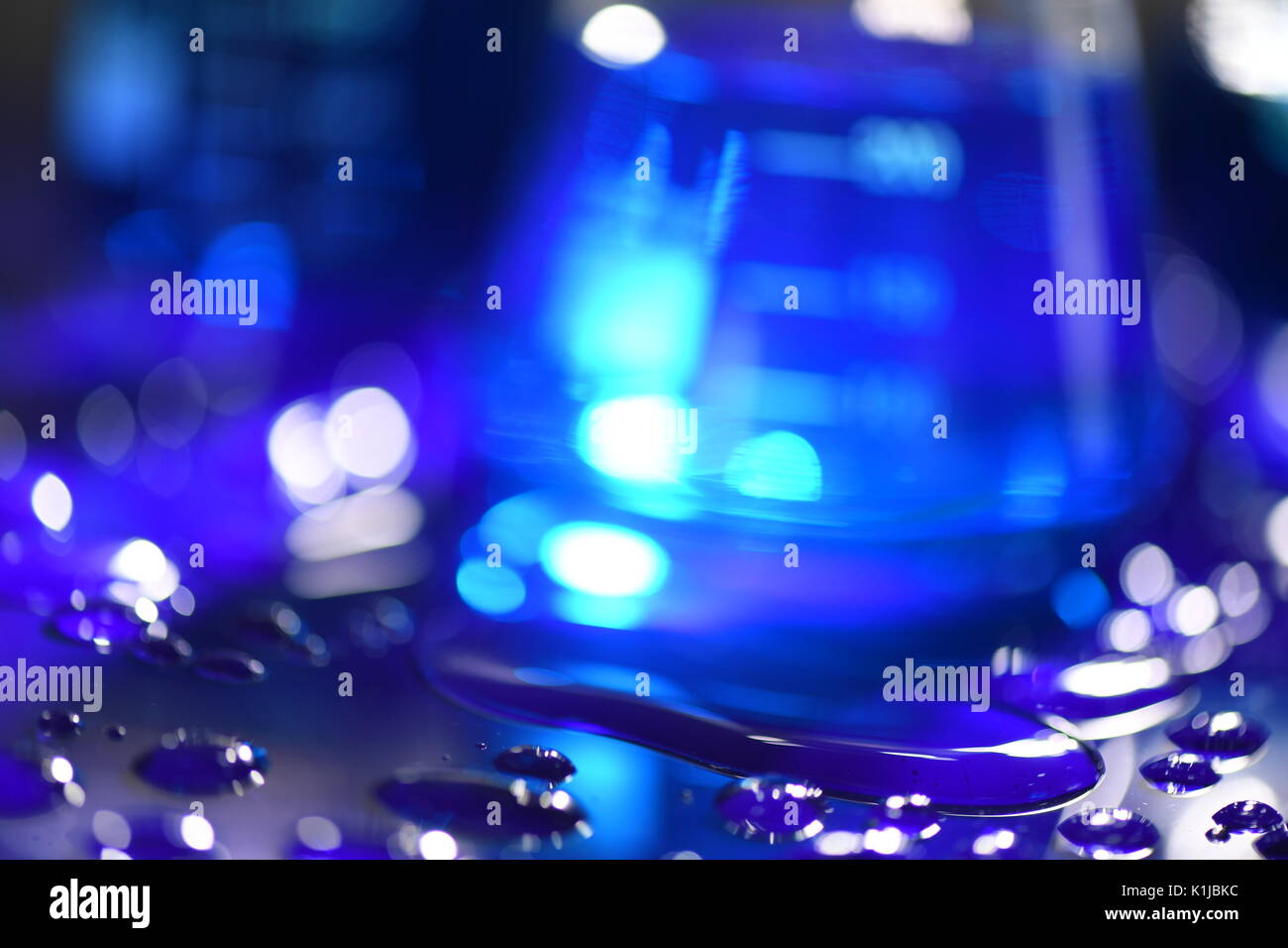 Graduated Conical Science Beakers on blue acrylic Stock Photo - Alamy