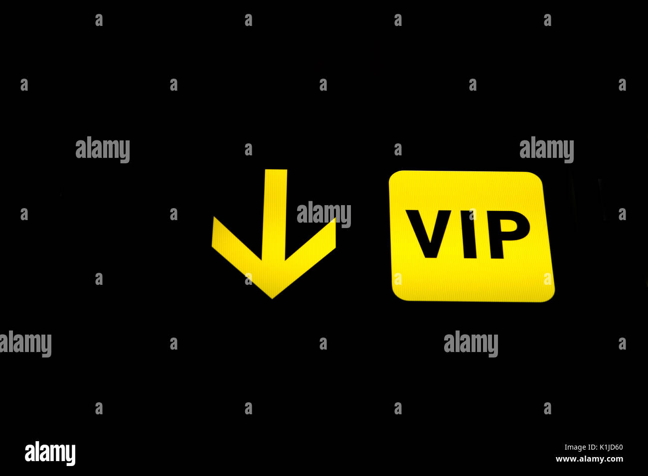 VIP sign arrow on black background Stock Photo - Alamy