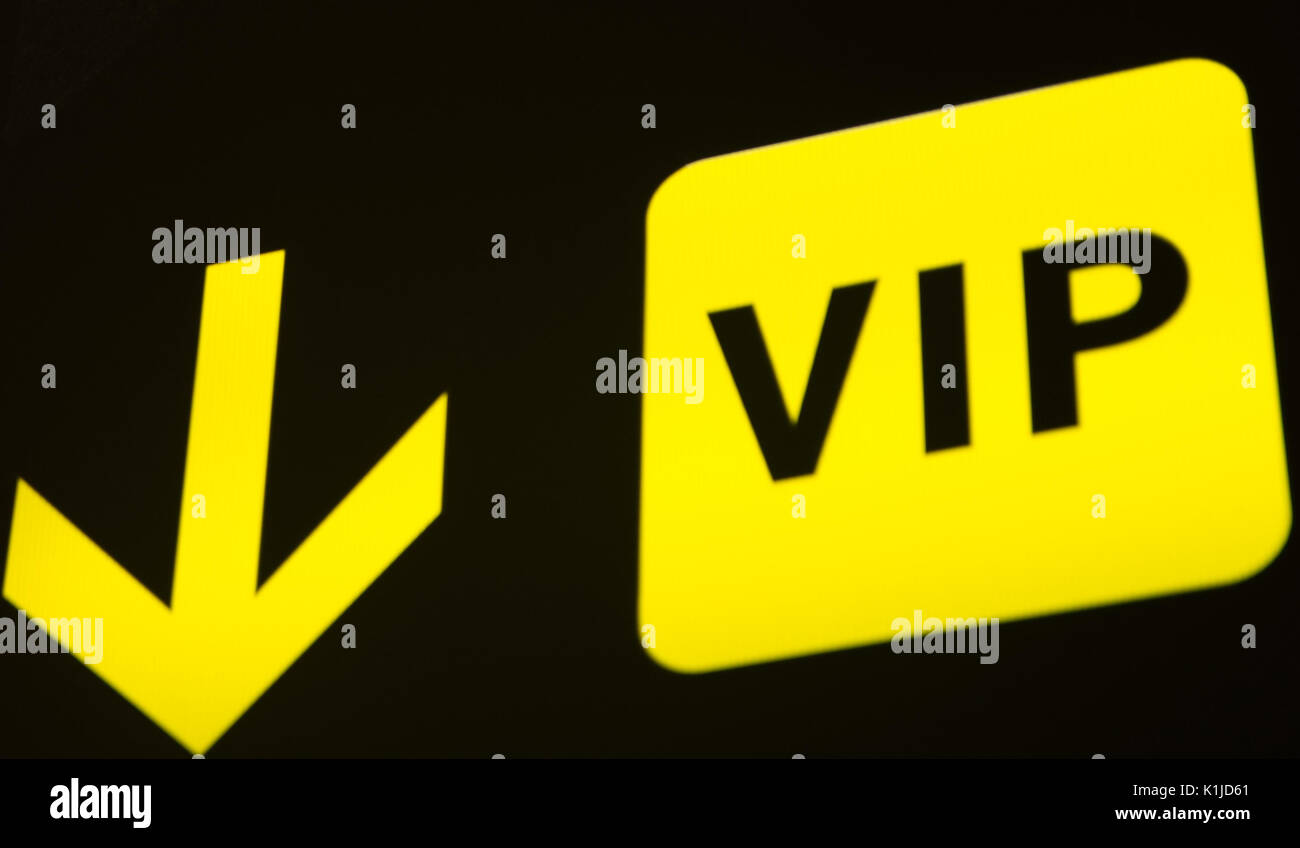 VIP sign arrow on black background Stock Photo - Alamy