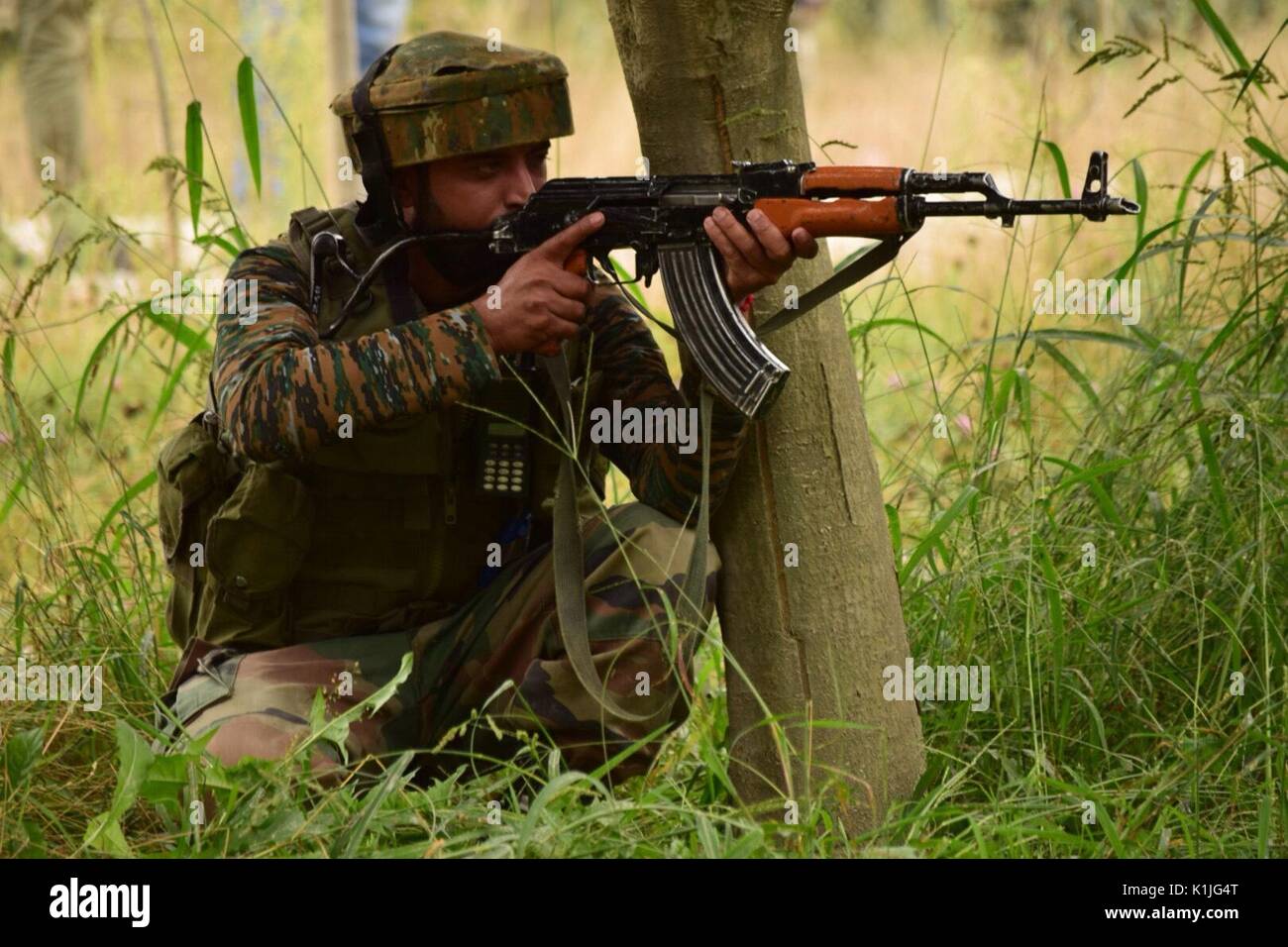Indian army take position near the site of the gunfight at the district ...