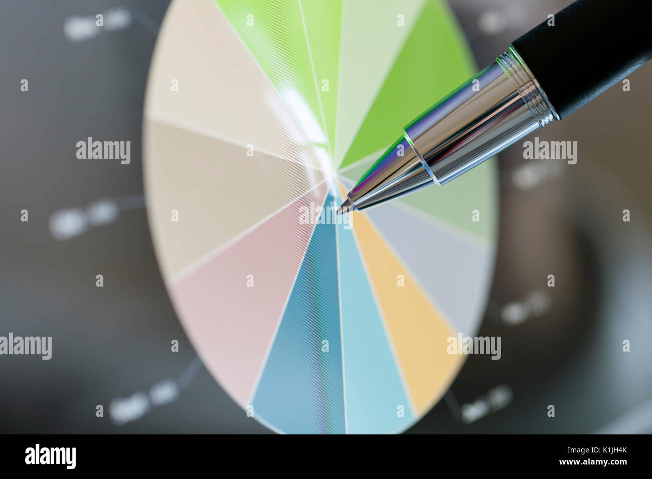 Analyzing stock market from a digital computer screen over a detailed ...