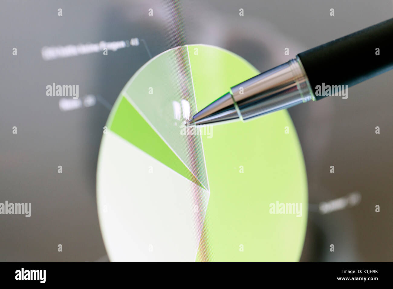 Analyzing stock market from a digital computer screen over a detailed ...