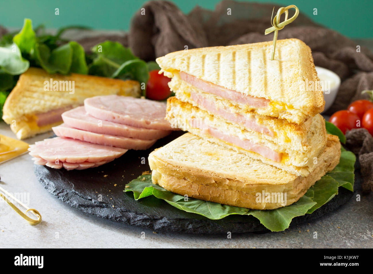 Pressed and toasted classic double sandwich with ham and cheese on a ...
