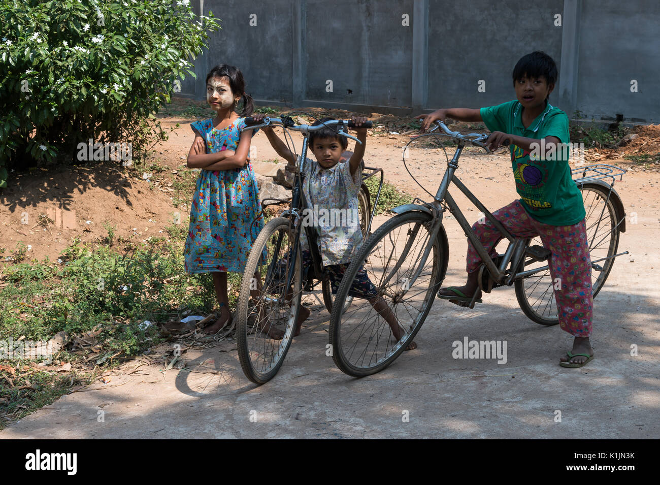 Burmese children with bicycles in Eindu village, Kayin State, Myanmar ...