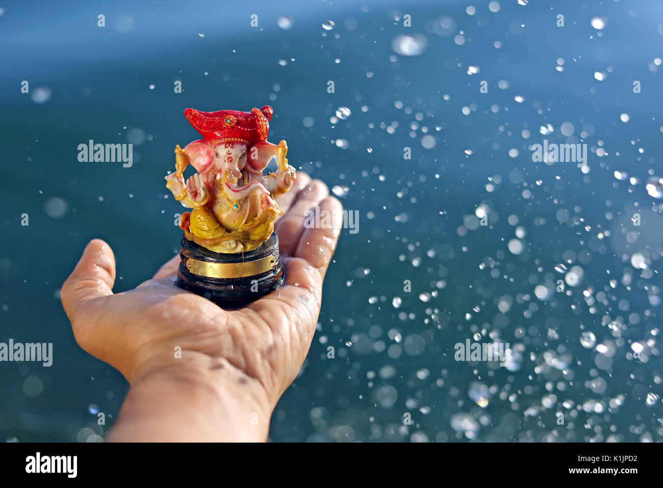 Lord Ganesha on hand Stock Photo - Alamy
