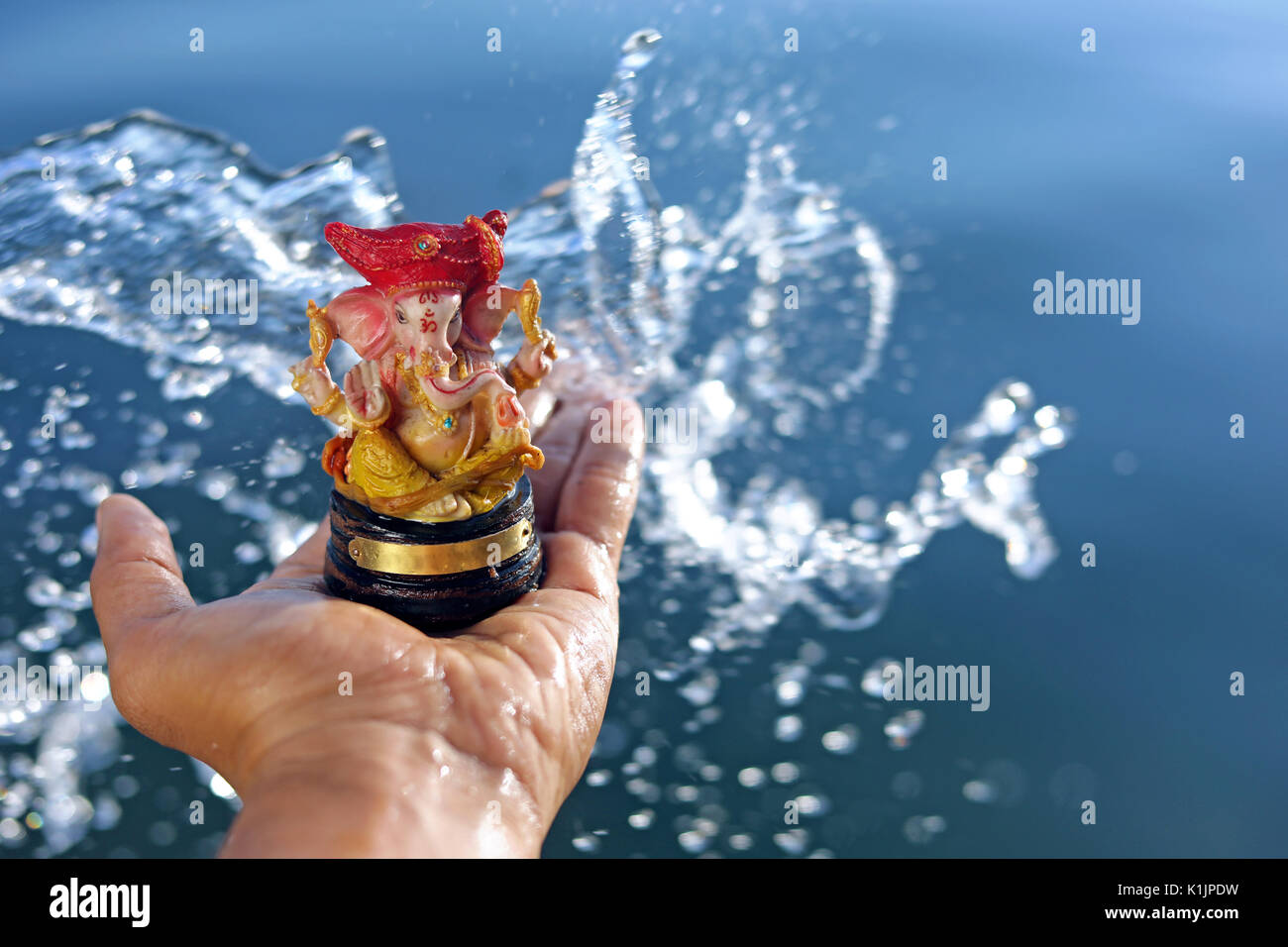 Lord Ganesha on hand Stock Photo - Alamy