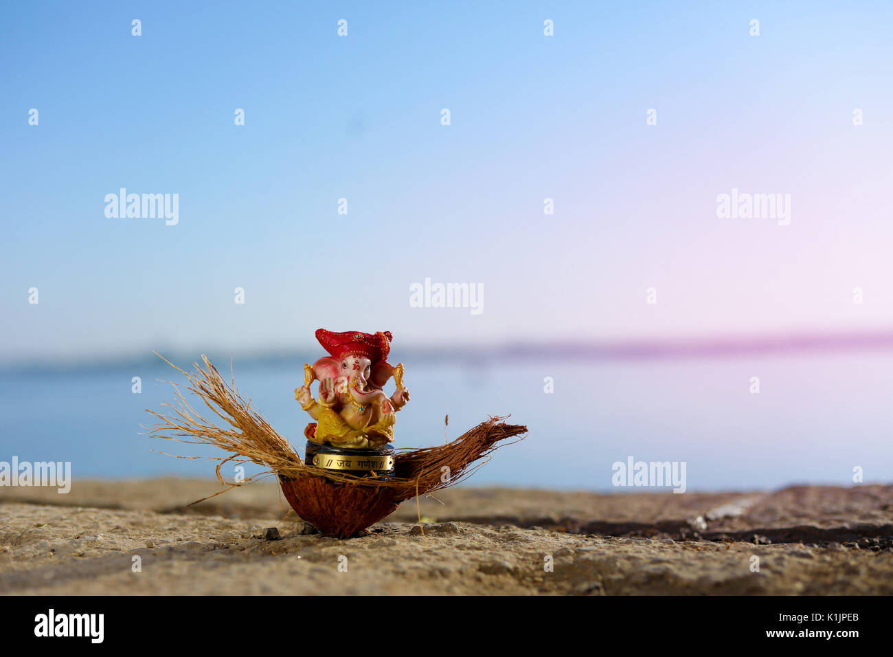 Lord Ganesha on coconut Stock Photo - Alamy