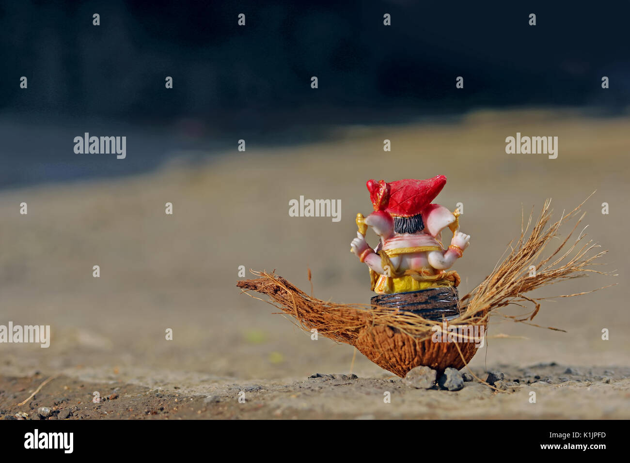 Lord Ganesha on coconut Stock Photo - Alamy