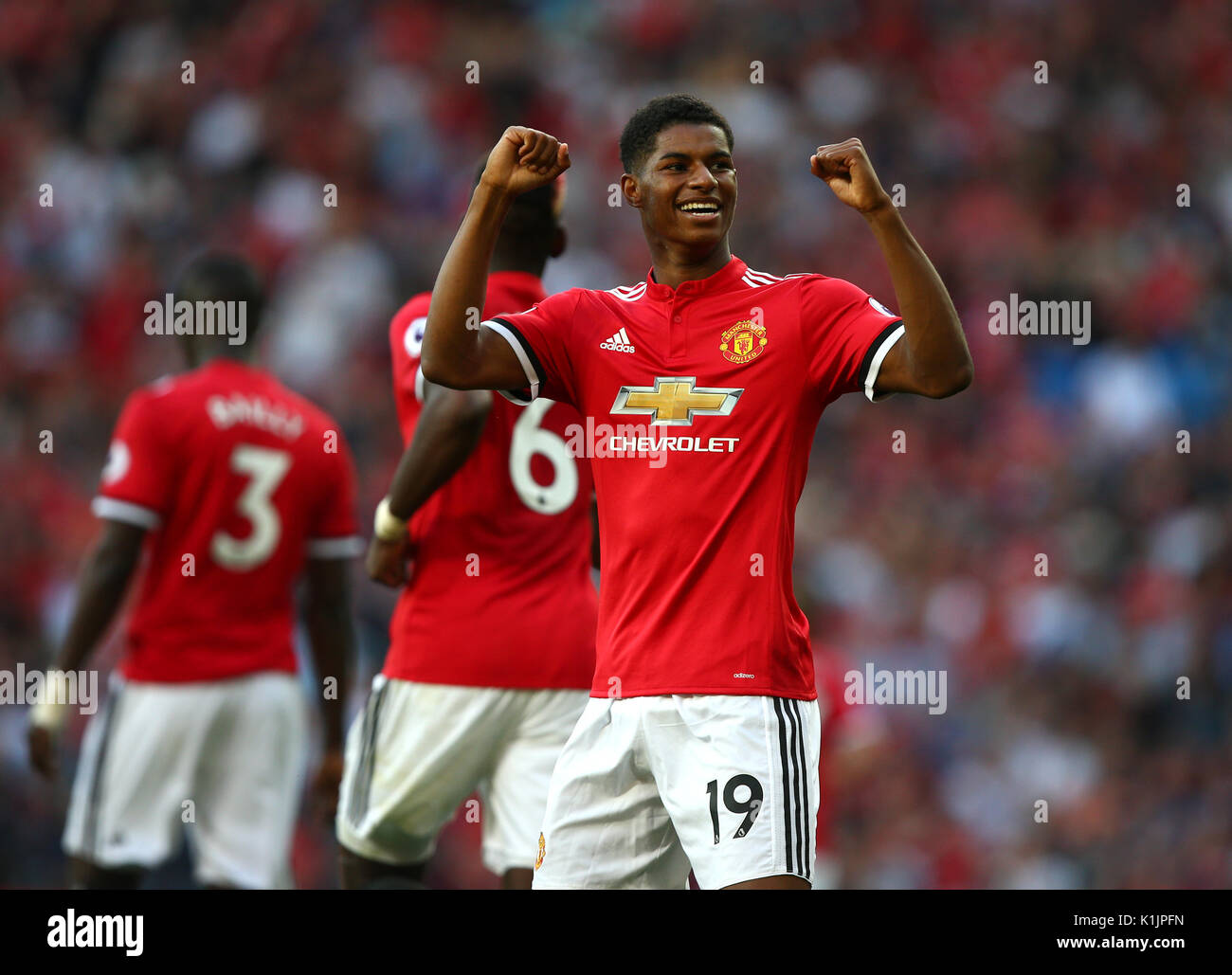 Manchester United's Marcus Rashford celebrates scoring his side's first ...