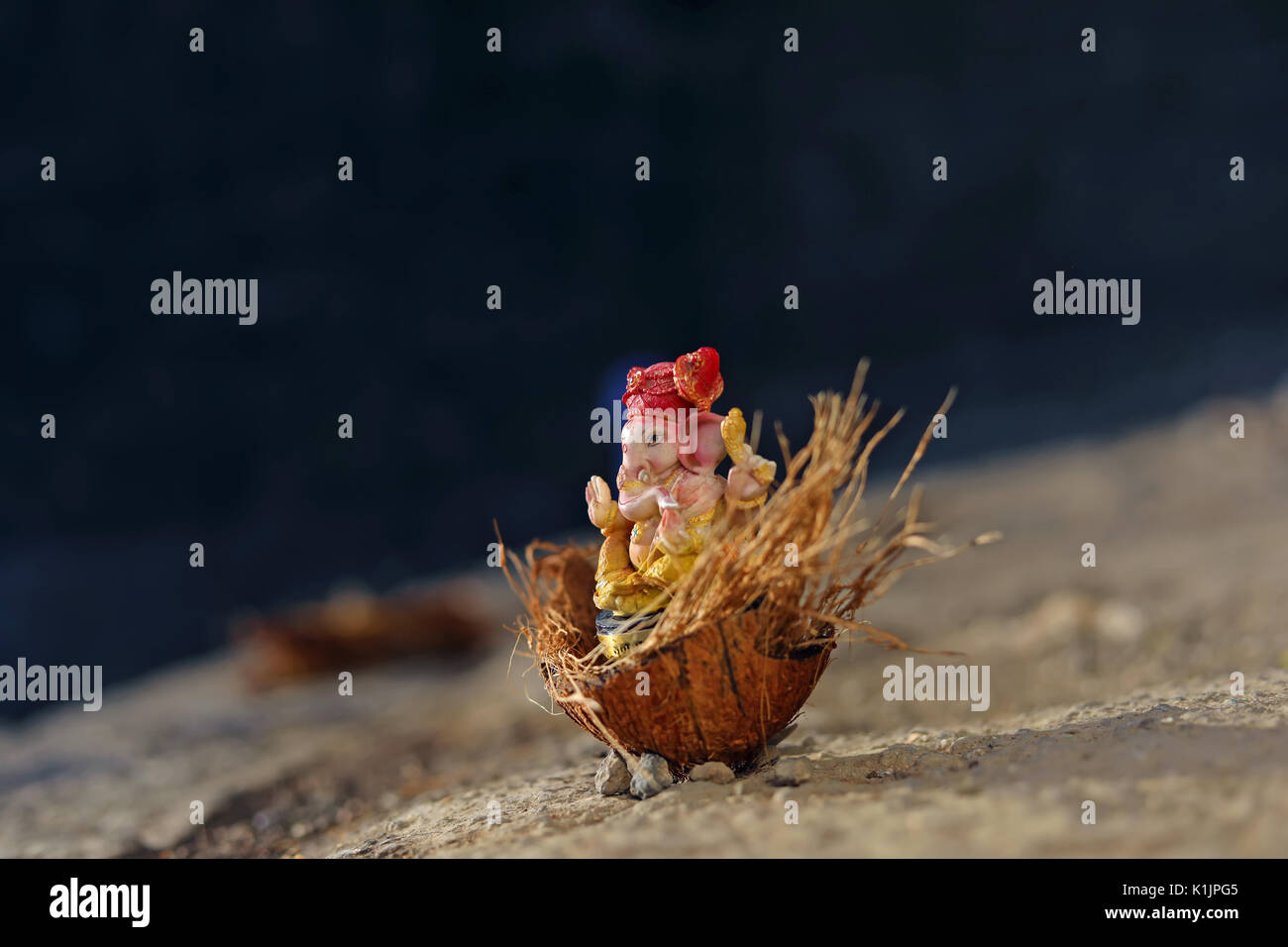 Lord Ganesha on coconut Stock Photo - Alamy