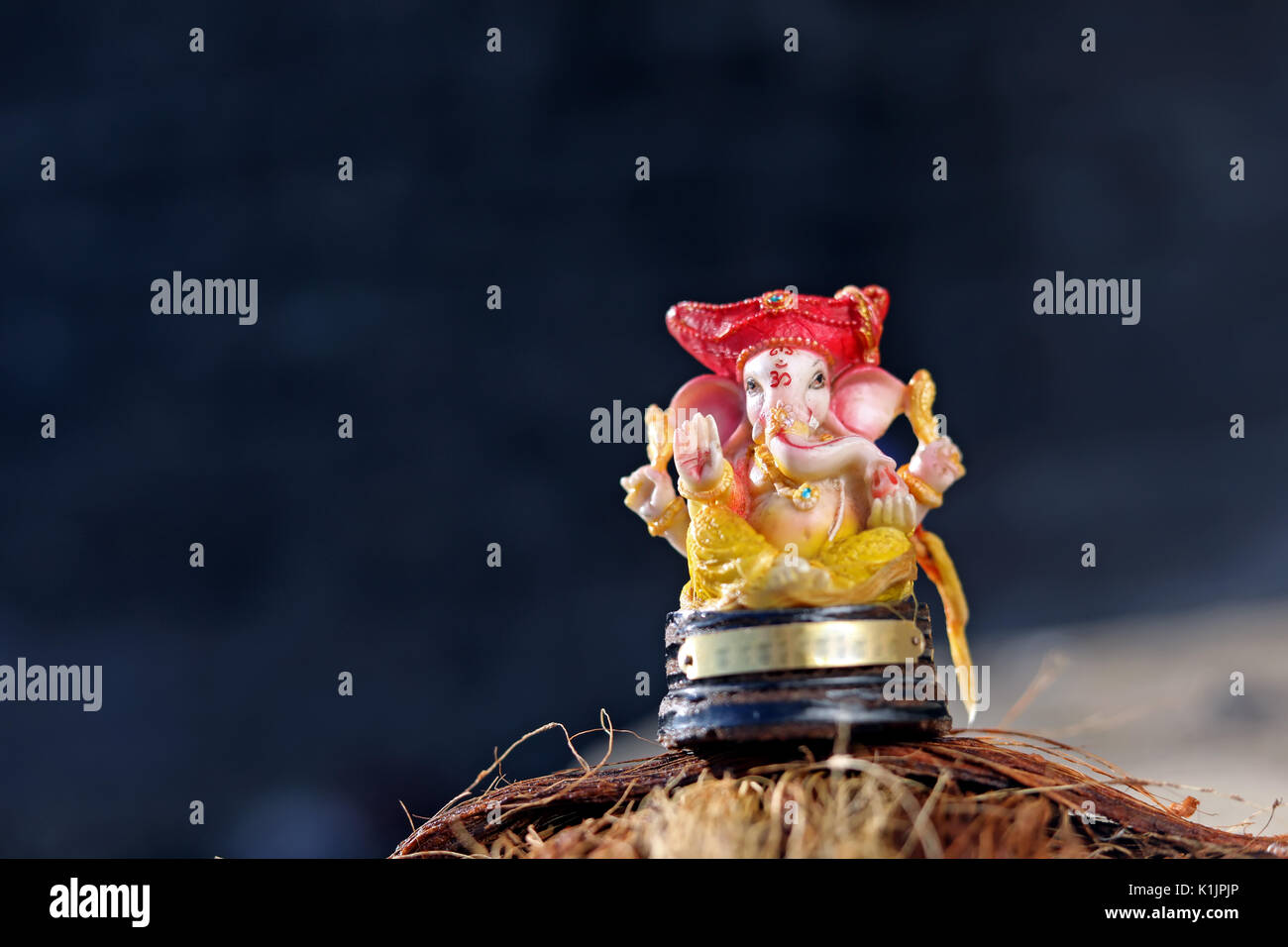 Lord Ganesha on coconut Stock Photo - Alamy