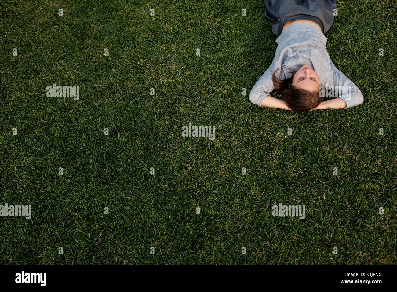 Woman laying down top view hi-res stock photography and images - Alamy