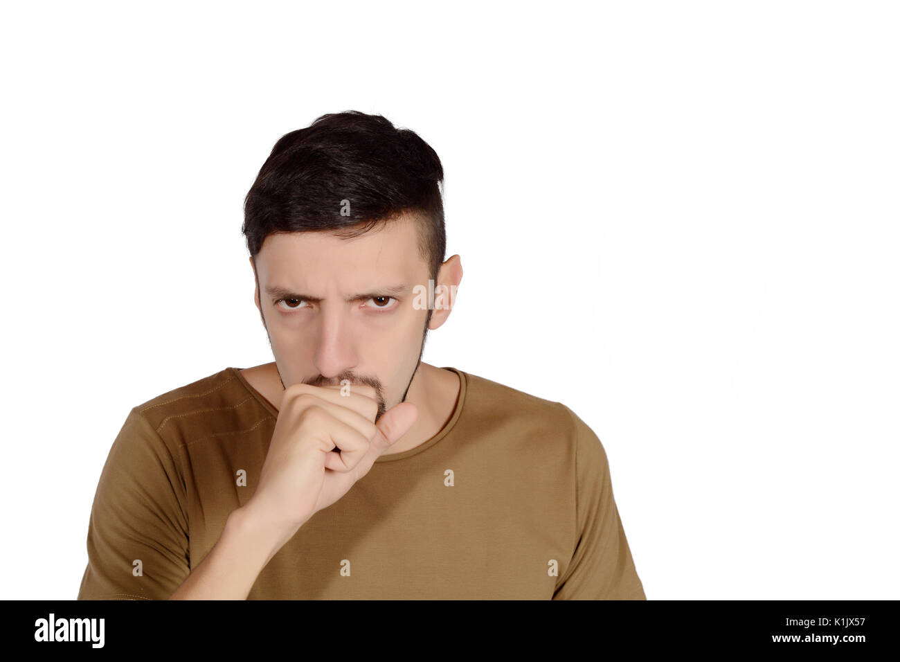 Portrait of a young man coughing. Isolated white background Stock Photo ...