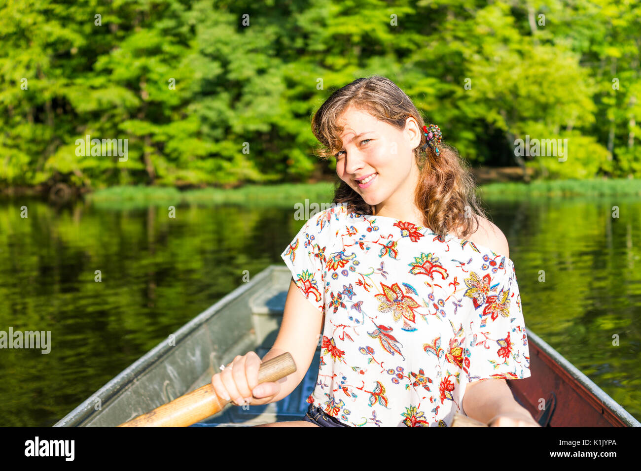 Smiling woman holding paddle hi-res stock photography and images - Alamy