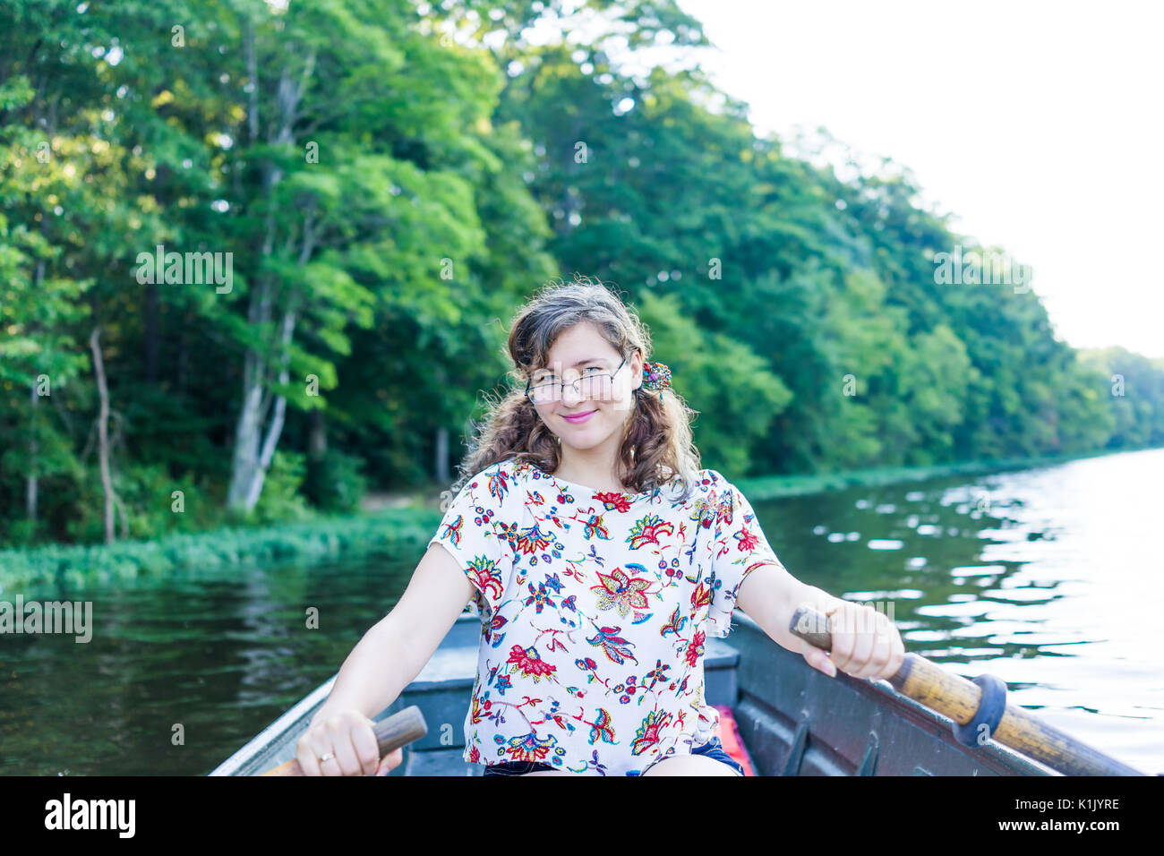 Girl rowing boat lake hi-res stock photography and images - Alamy