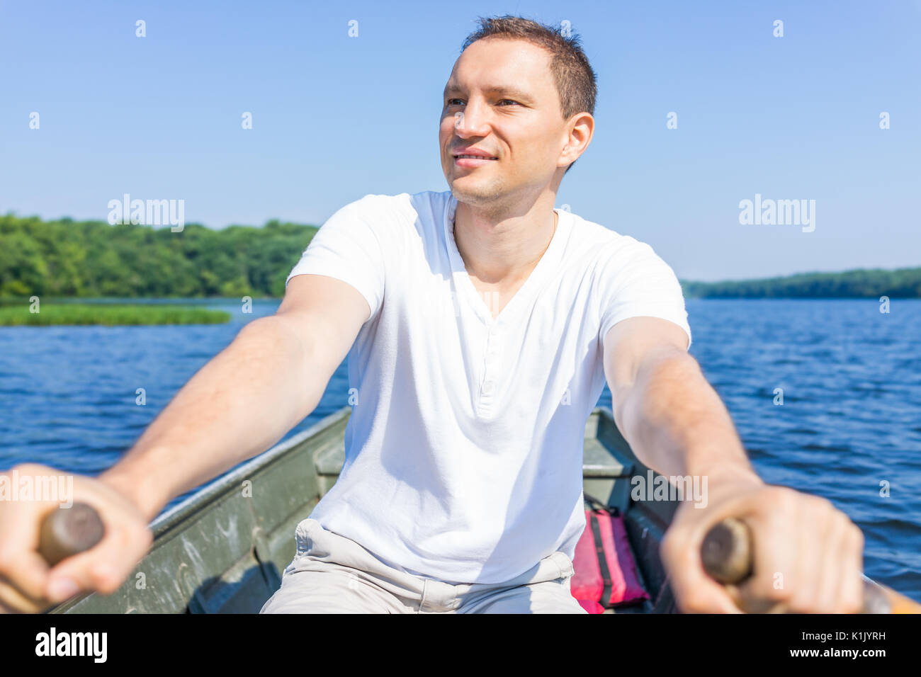 Man rowing boat hi-res stock photography and images - Alamy
