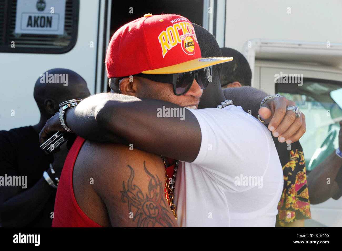 (L-R) Red Cafe Akon hugging DUB Magazine Show Los Angeles Convention ...