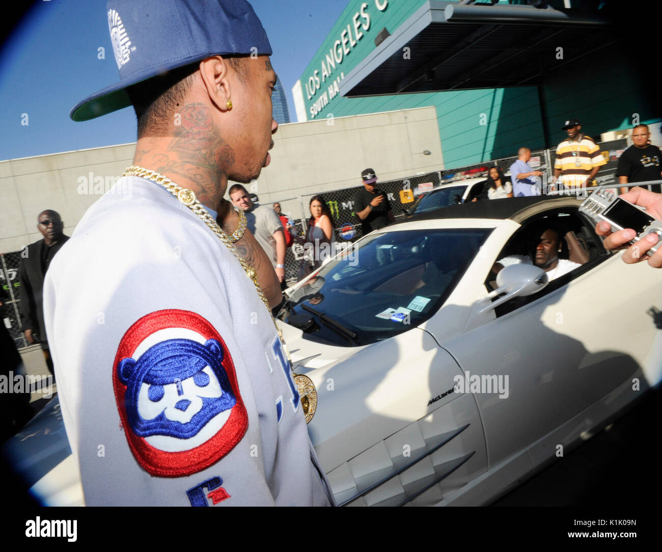 Rapper Tyga talking to Akon leaving DUB Magazine Show wearing all white ...