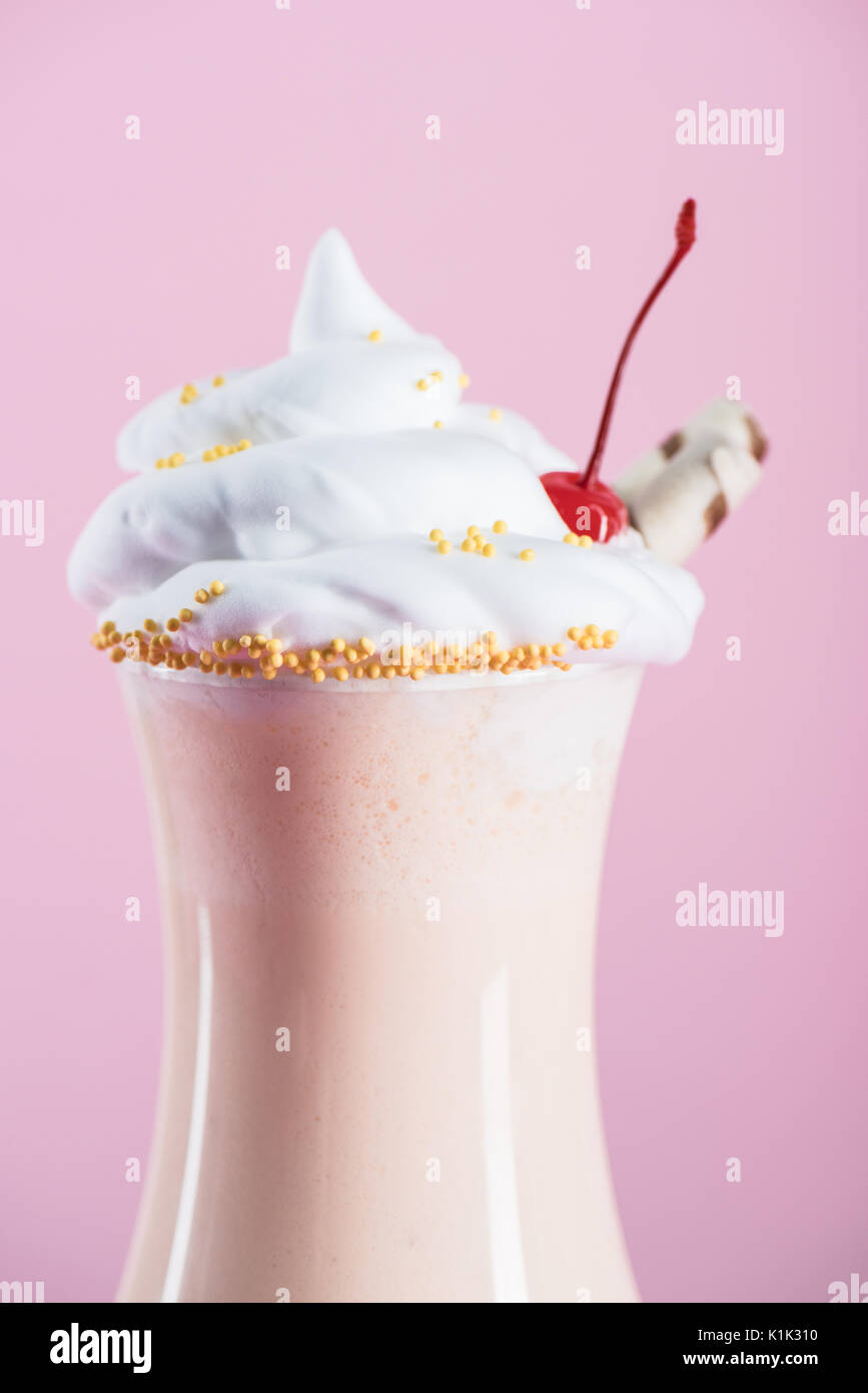 close up view of milkshake with cream and cherry on top in glass Stock ...