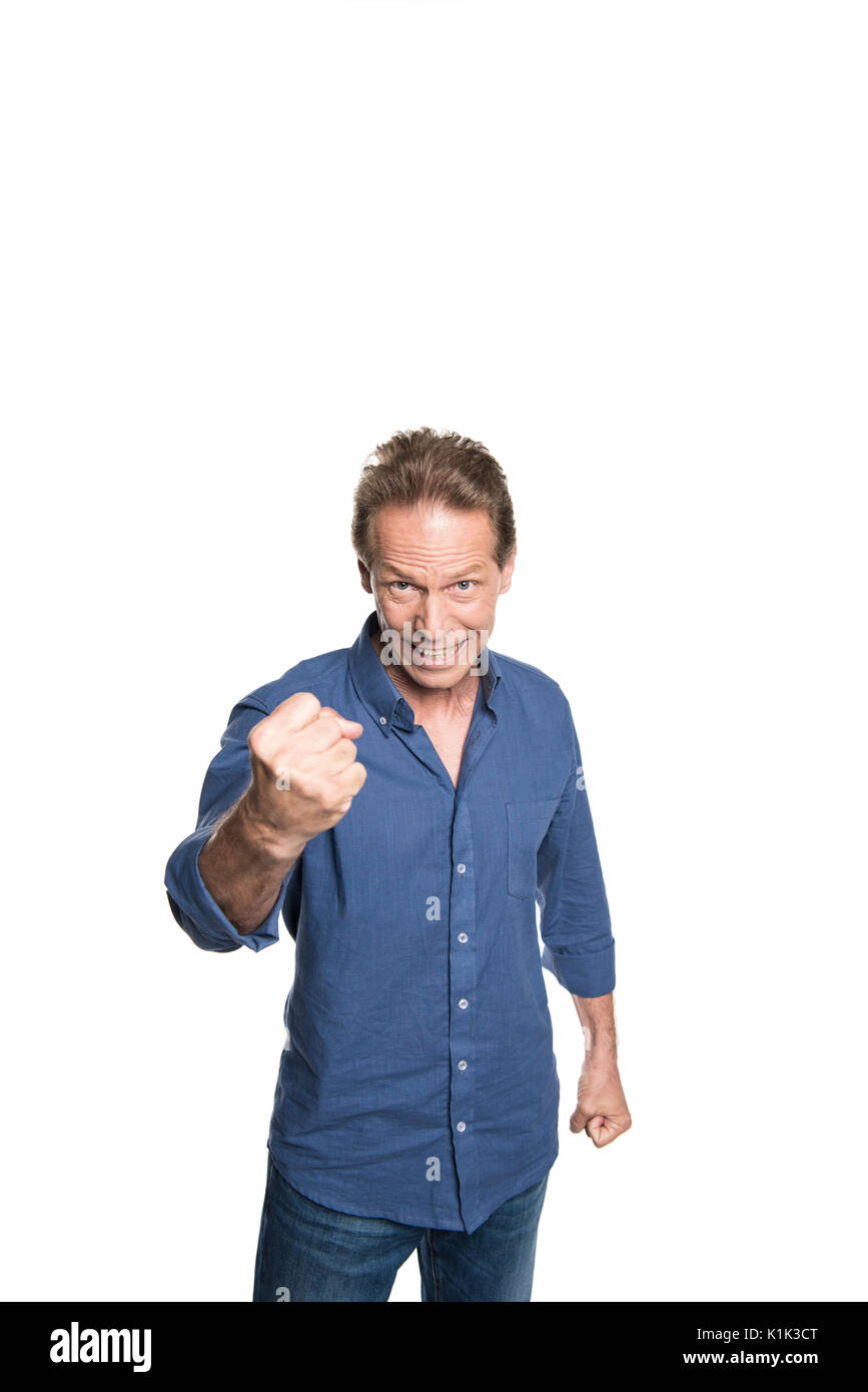 angry middle aged man in casual clothes showing a fist isolated on ...