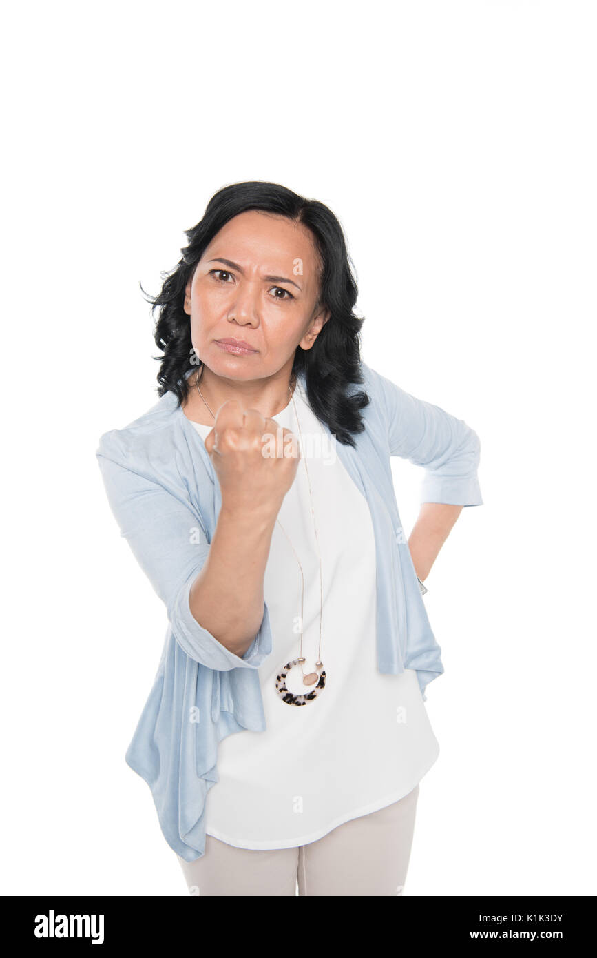 serious casual asian woman menace with fist isolated on white Stock ...