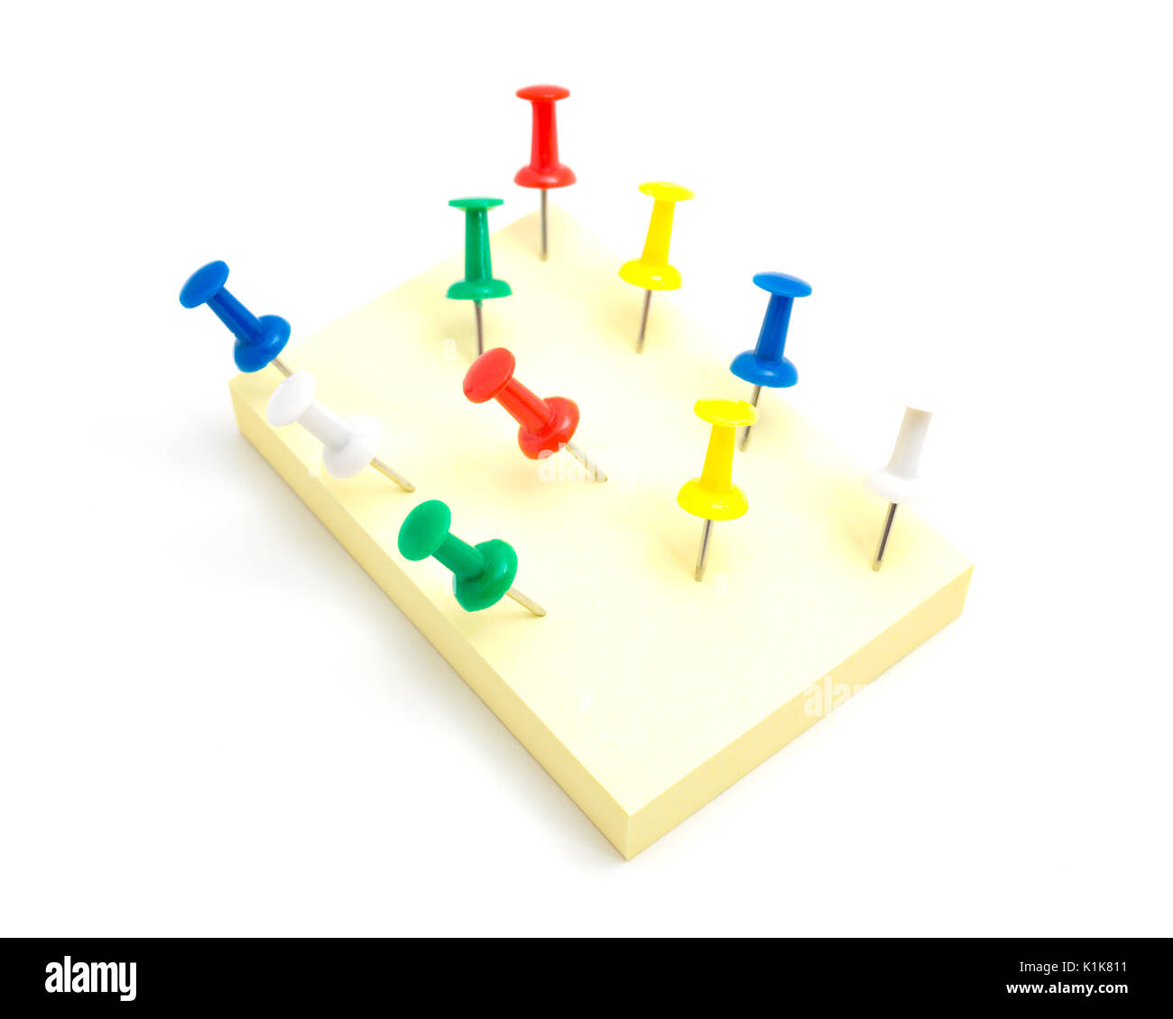 Ten push pins and yellow sticky note on isolated white background Stock ...