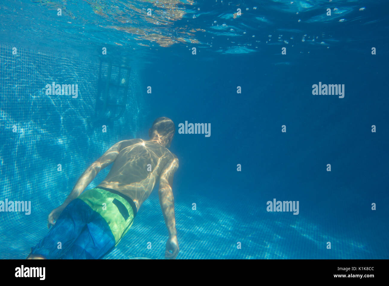 Man underwater in a swimming pool Stock Photo - Alamy