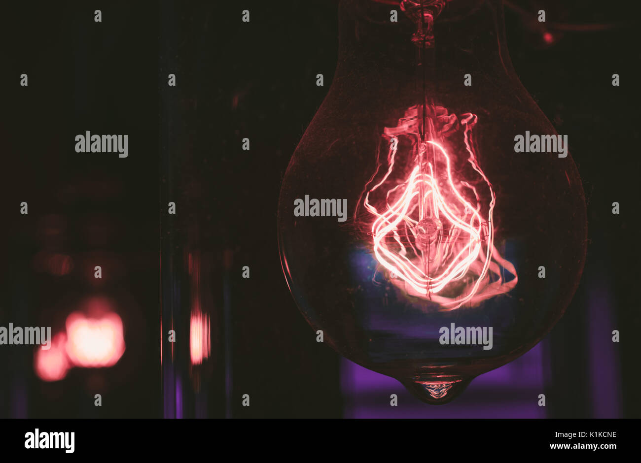 close up of glowing red dusty light bulb Stock Photo - Alamy