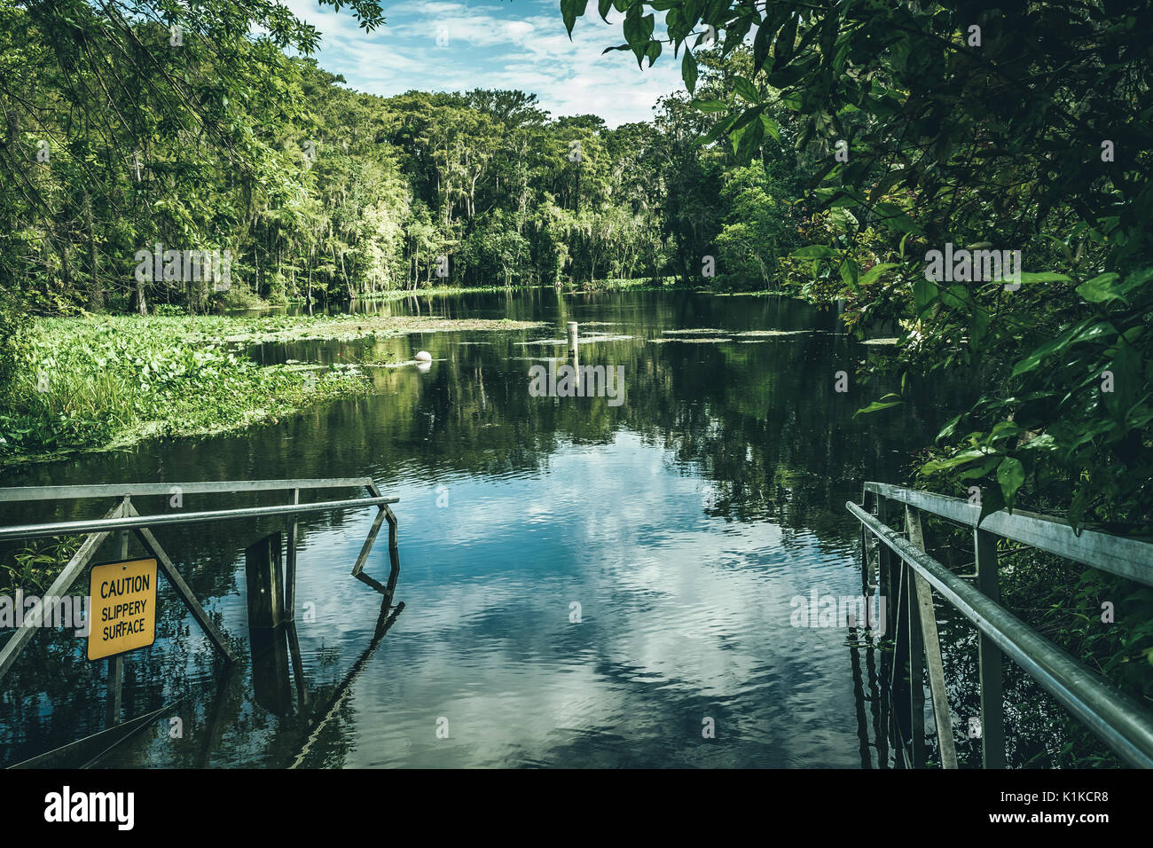 kayak and boat ramp into natural spring water seen while hikinh on a ...